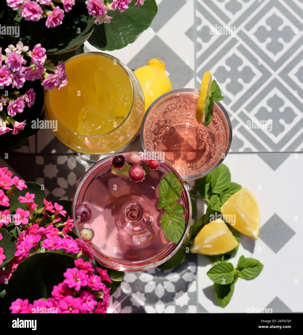 Refreshing summer cocktails on a garden table. Close up photo of ...