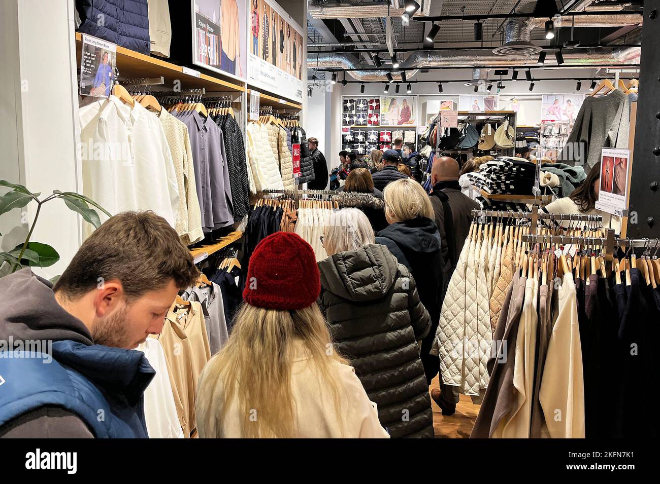 Long queue for customers to pay at the check outs at Uniqlo inside ...