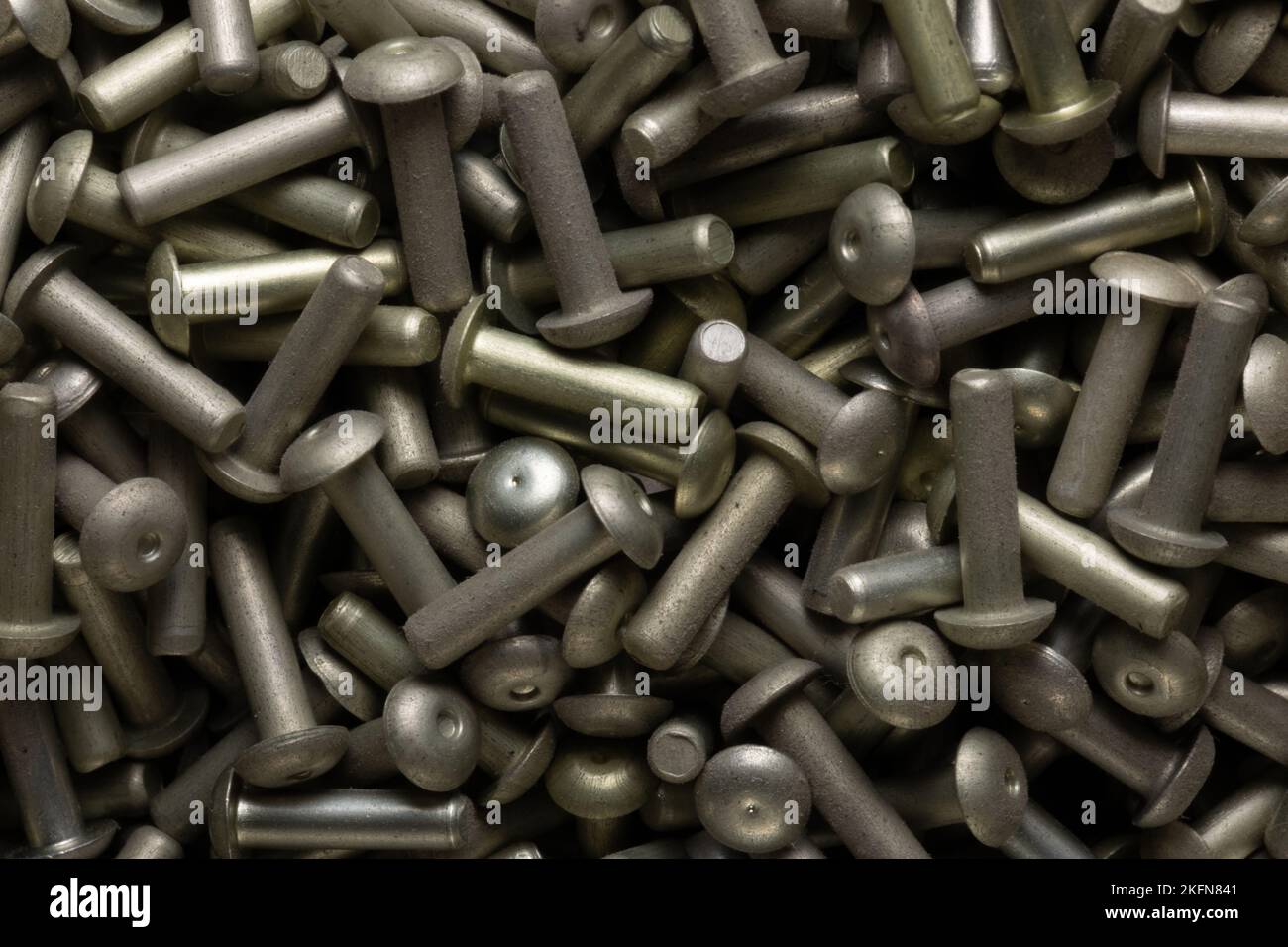 A top view of heap of dark gray steel rivets Stock Photo - Alamy