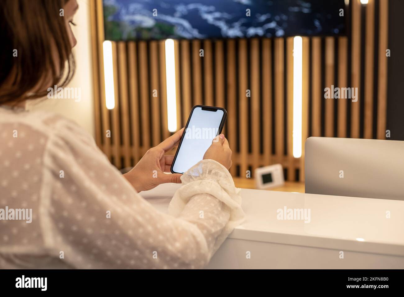 A young female using her phone with a blank screen Stock Photo - Alamy