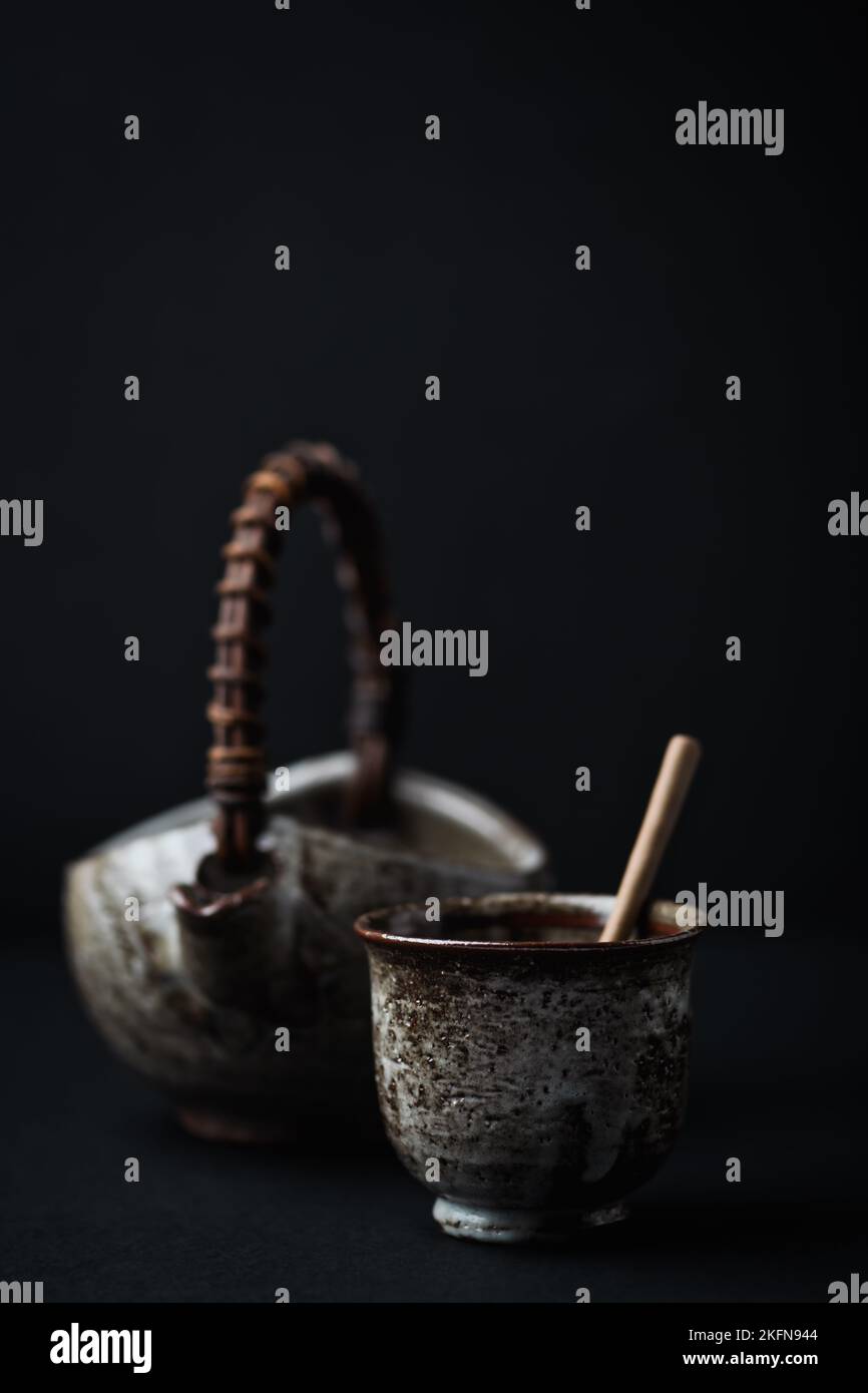 Traditional, handcrafted ceramic on dark background. Soft focus. Close ...