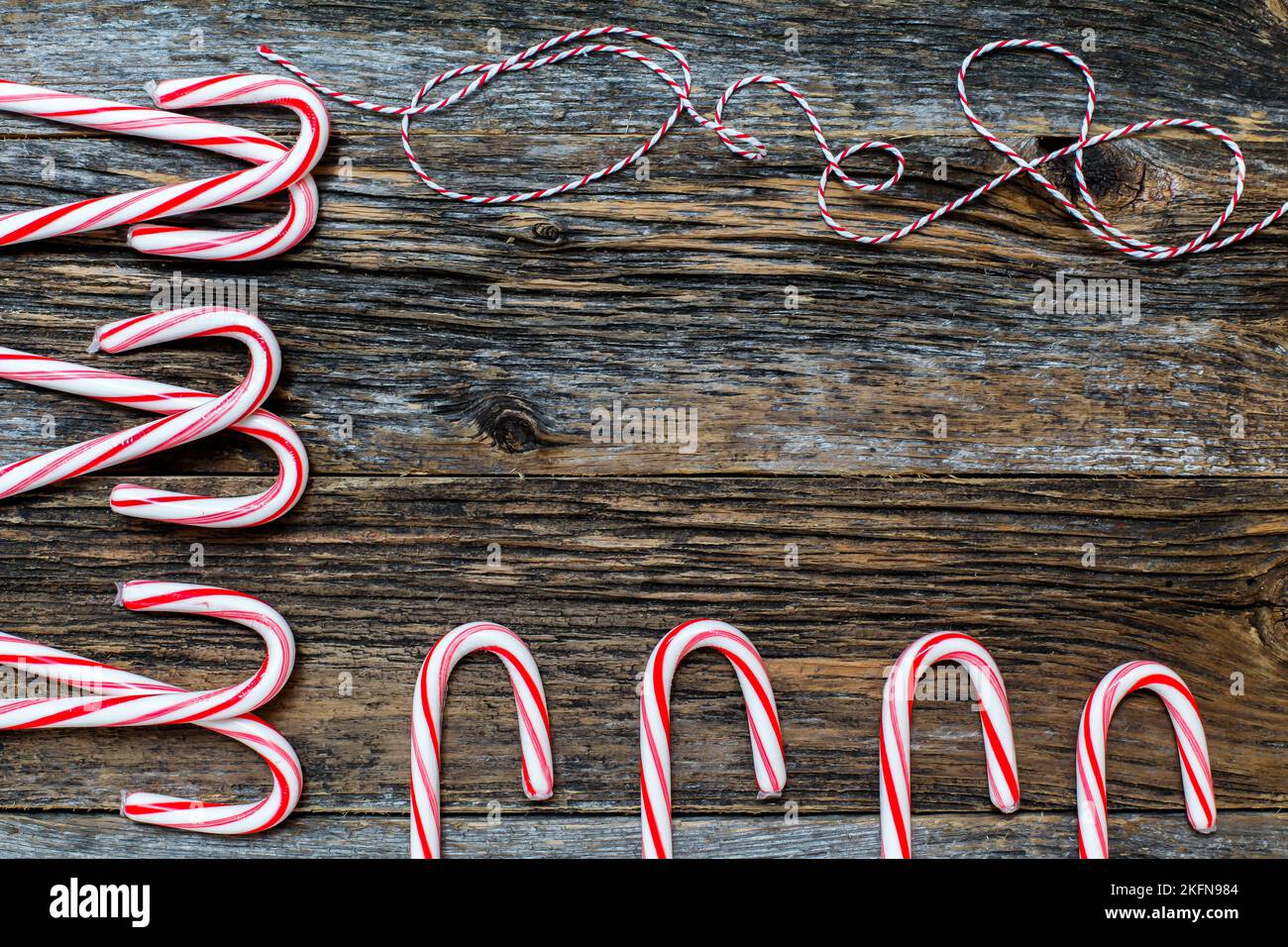 Rustic wood with candy canes Stock Photo - Alamy
