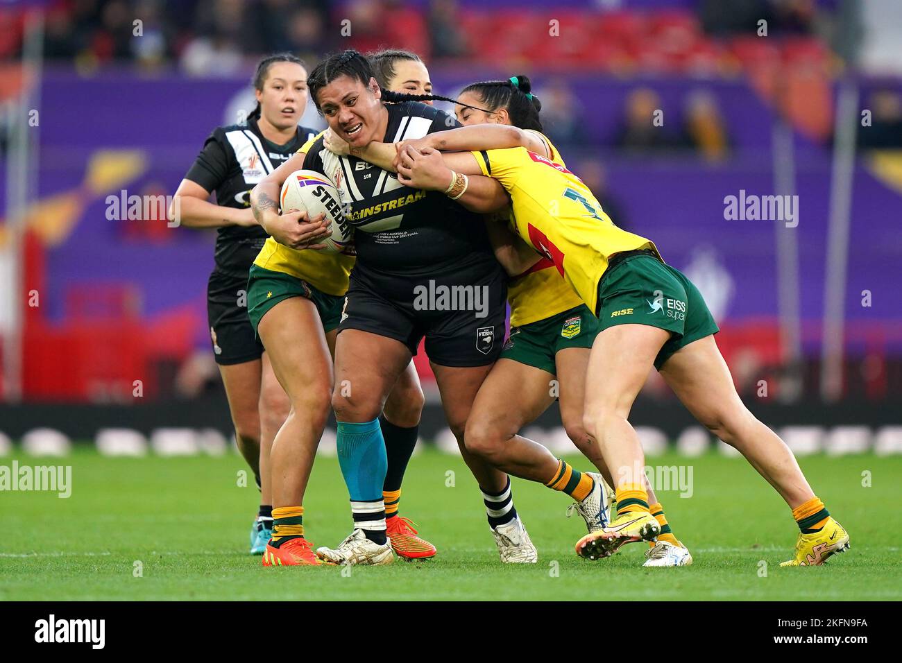 New Zealand's Amber Hall (centre) is tackled by Australia's Isabelle ...