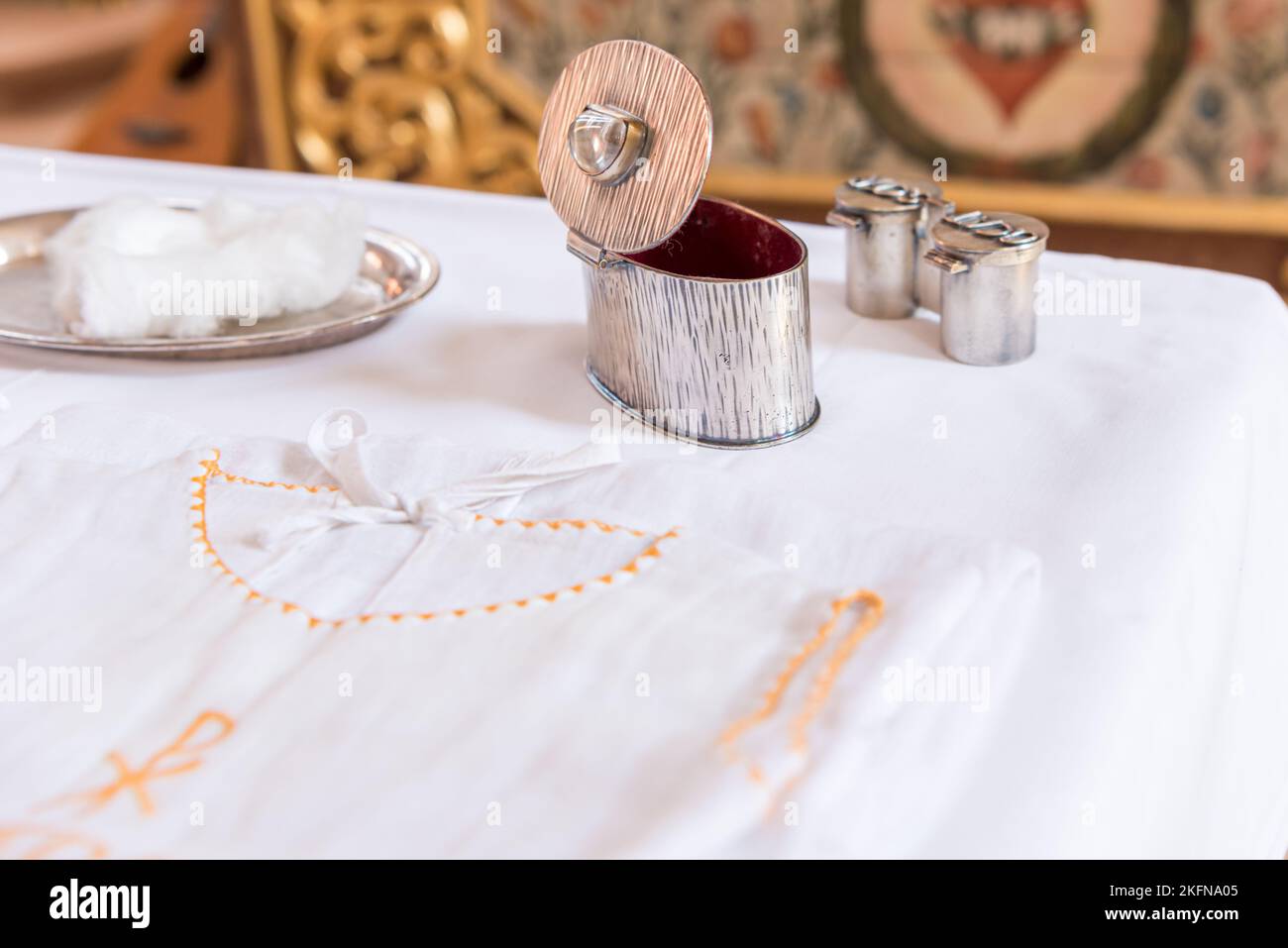 chrisam oil in a vessel and holy water in a bowl. Preparation for the sacrament baptism Stock ...