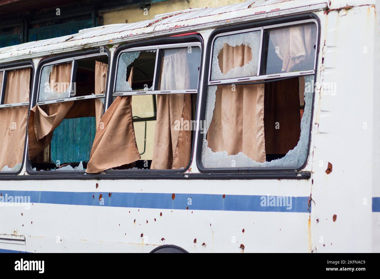 Broken, shelled, broken bus windows during the war Stock Photo - Alamy