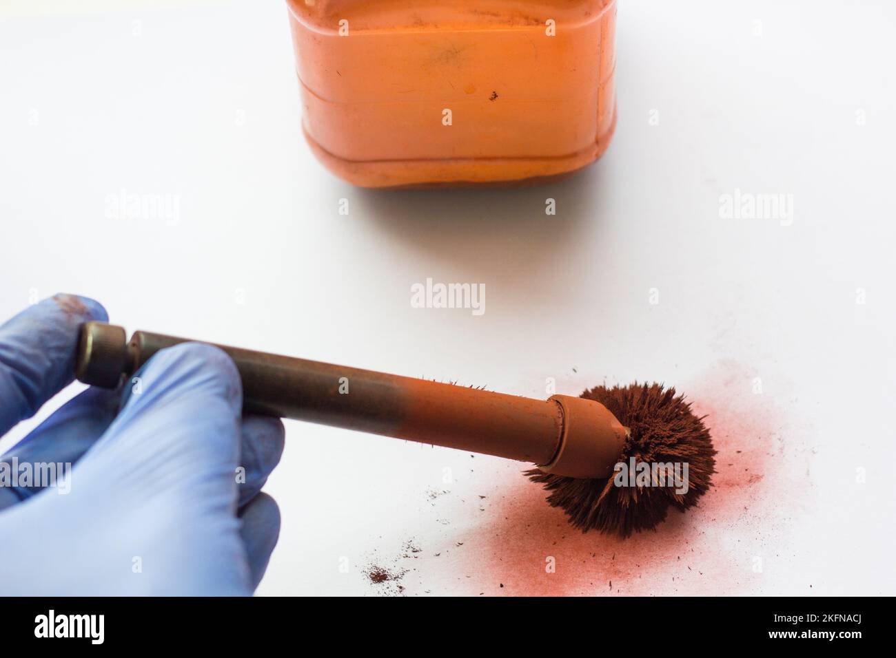 The hand of an expert in a rubber glove examines the footprints Stock ...