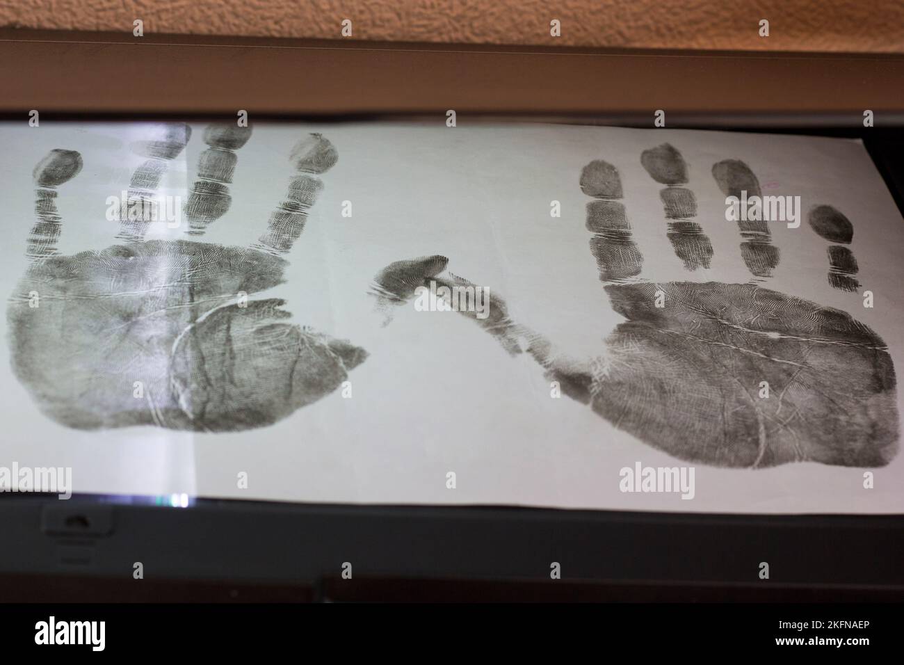Scanning the fingerprints of a suspected person in a crime Stock Photo ...