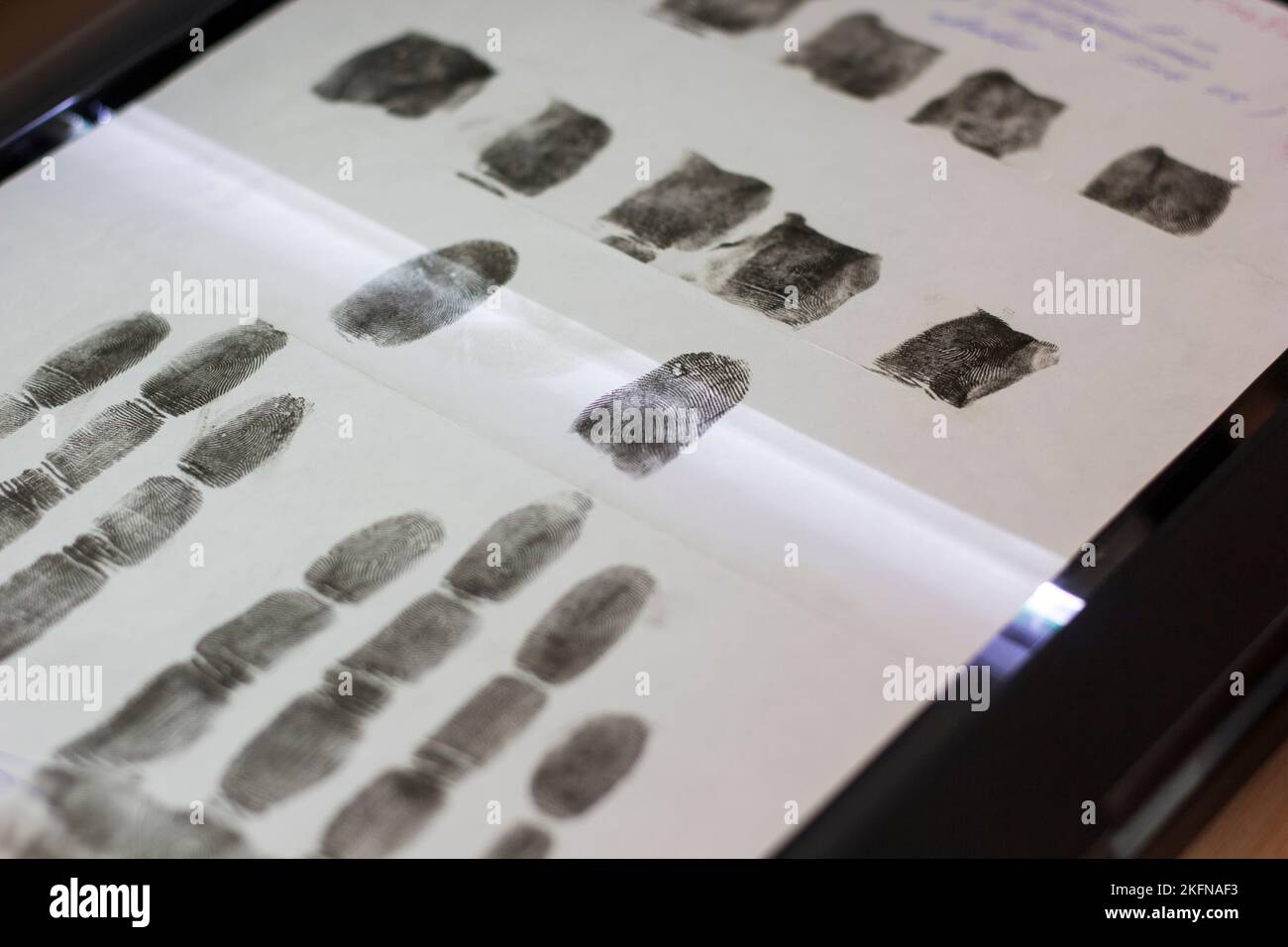 Scanning the fingerprints of a suspected person in a crime Stock Photo ...
