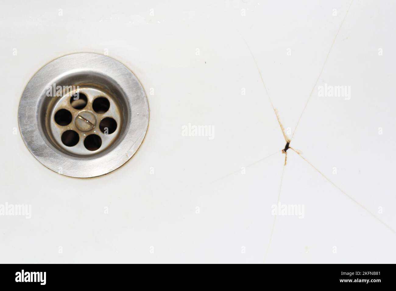 Hole with a crack in the sink close-up Stock Photo - Alamy