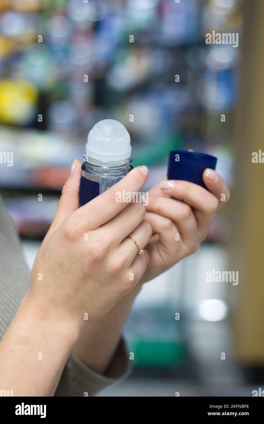 female hands hold deodorant Stock Photo - Alamy