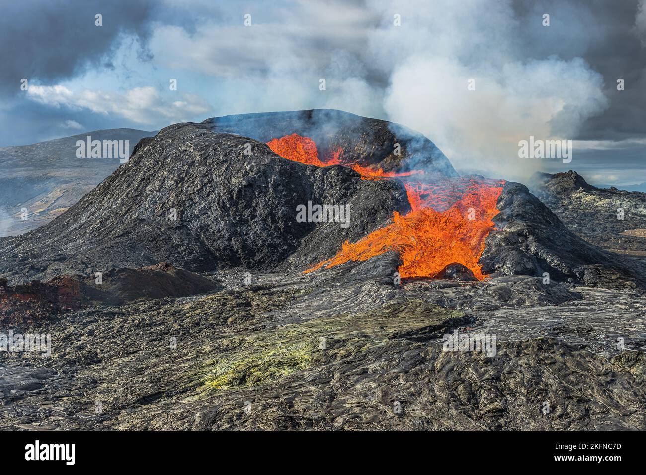 Spouting volcano with lava fountains on Iceland. View of active volcano ...