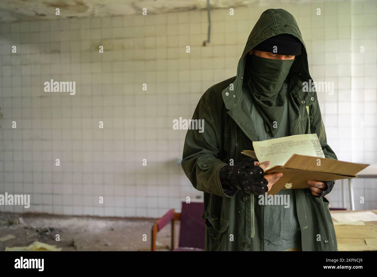Disaster survivor in a post apocalyptic world, he is wearing a bandana ...