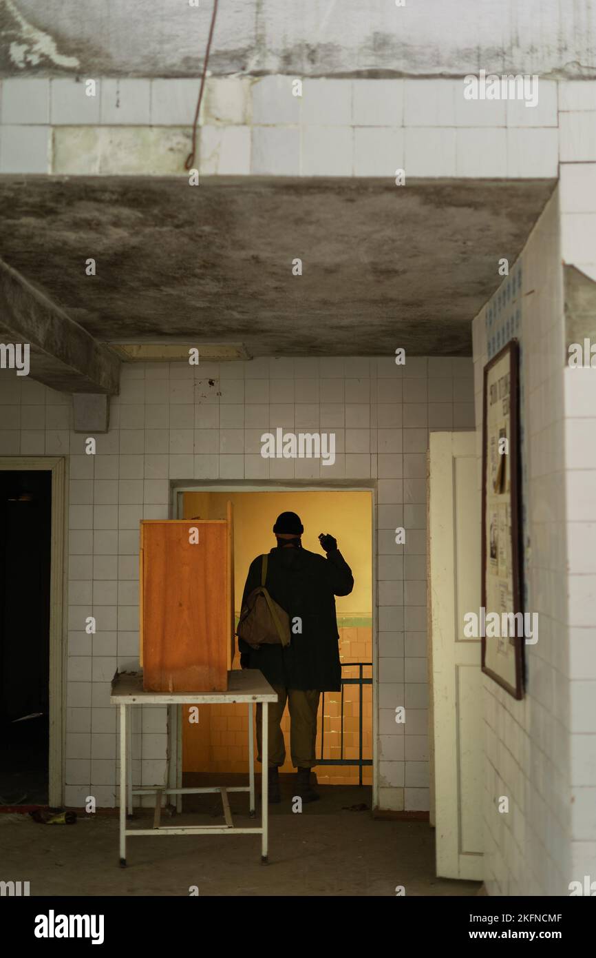 Environmental disaster. Post-apocalyptic survivor in gas mask on a dark ...