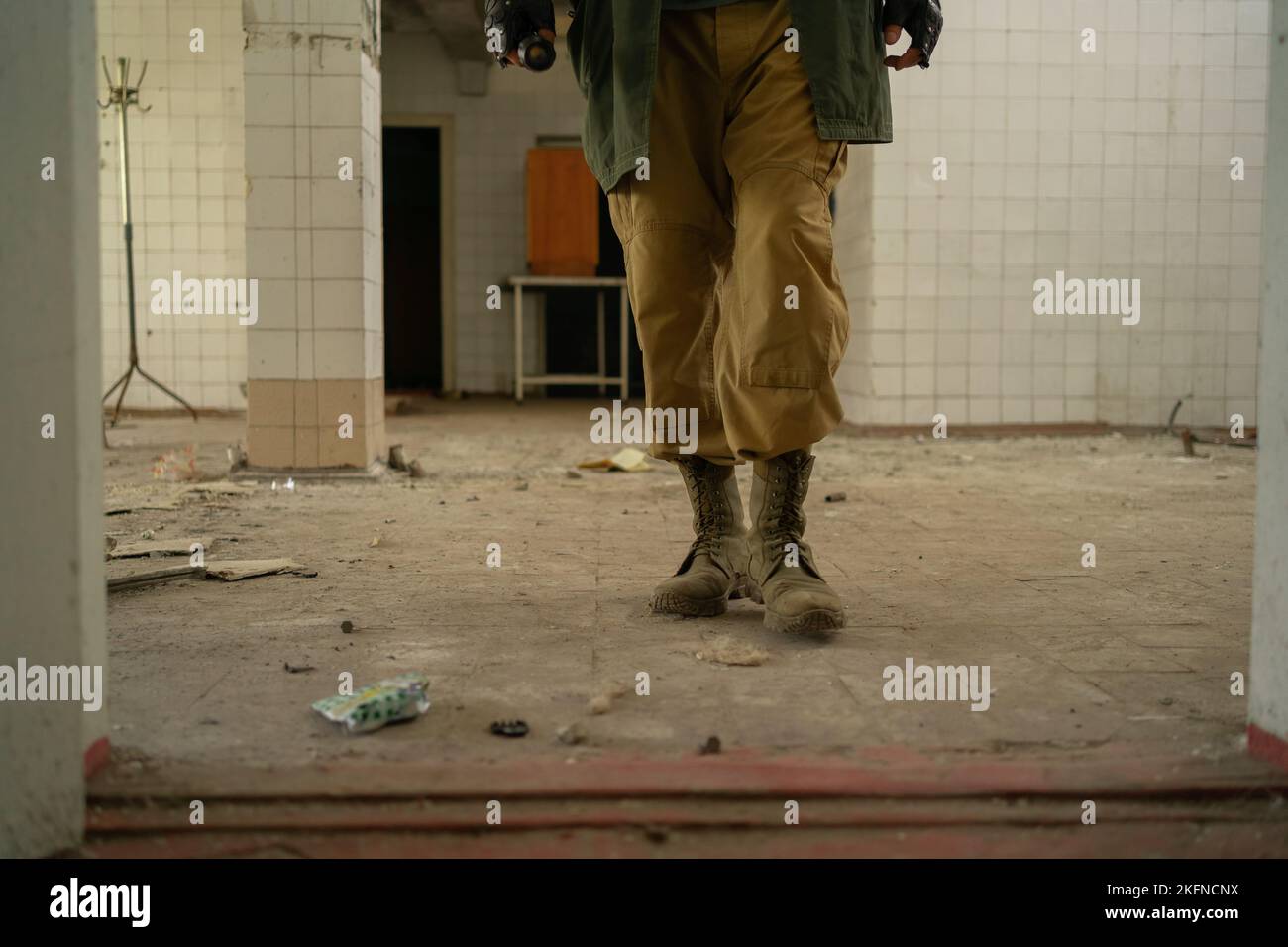 Young man walking in an abandoned building. wandering guy. Post ...