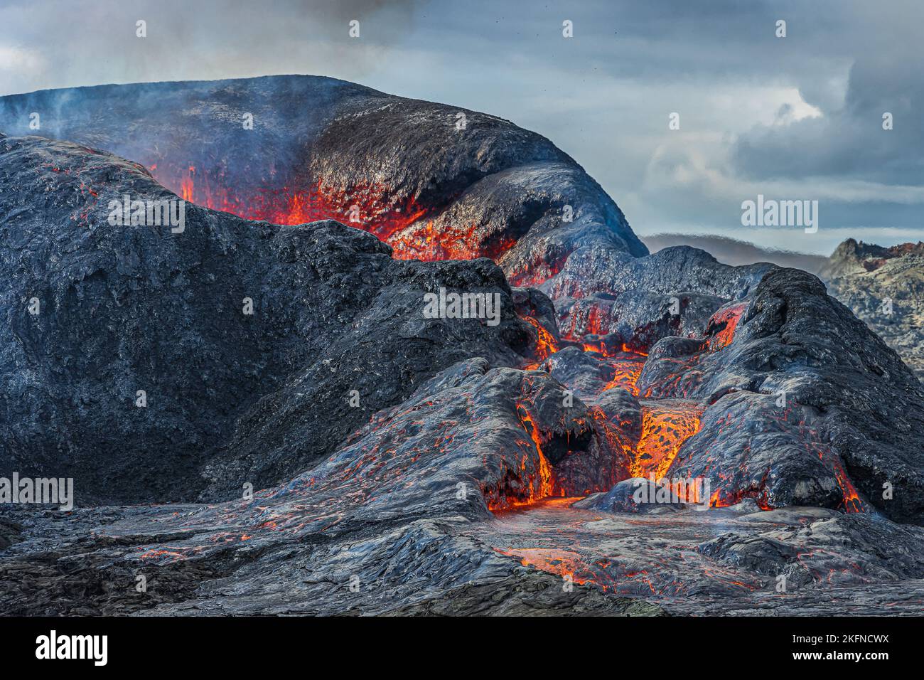 View into the volcanic crater opening after an eruption. hot glowing ...