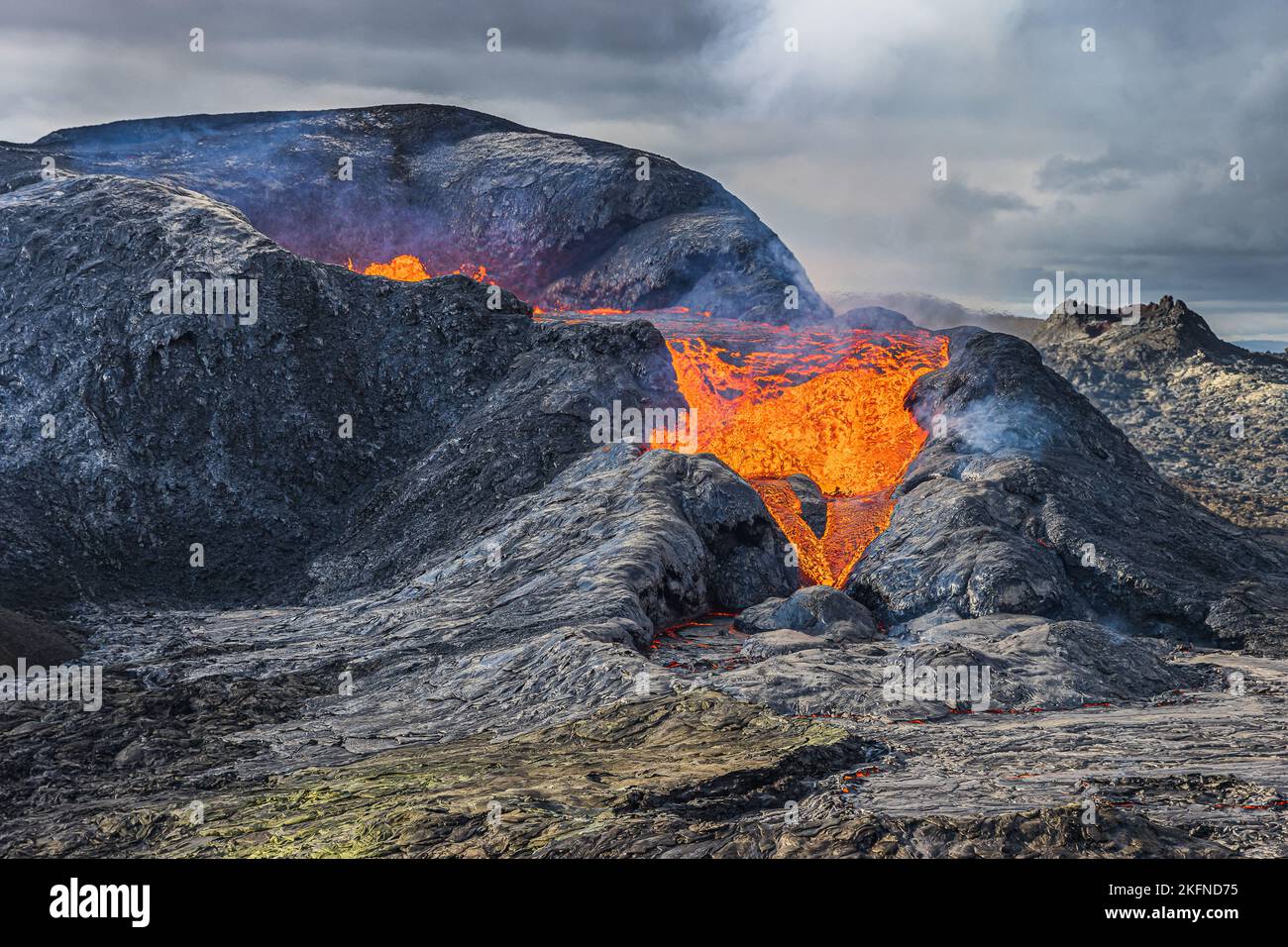 stronger lava flow from a volcanic crater. Landscape on Iceland of ...