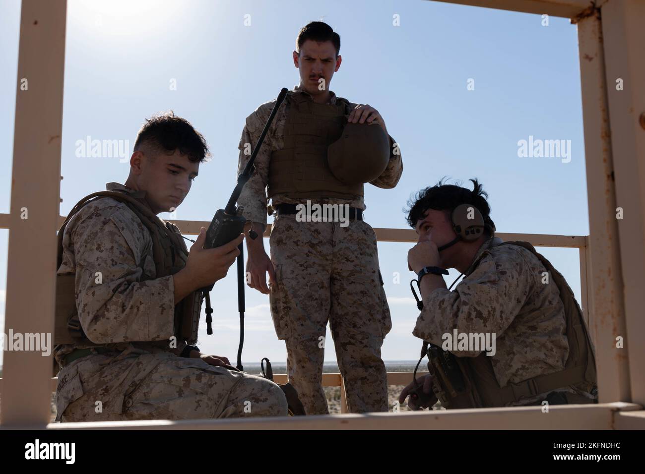U.S. Marine Corps Sgt. Kyle Althoff, center, a ground radio repairman ...