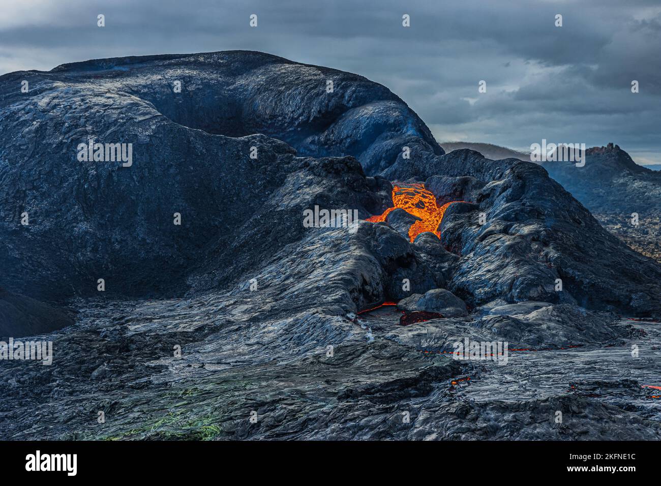 Opening of a volcanic crater during the day. crater with some lava flow ...