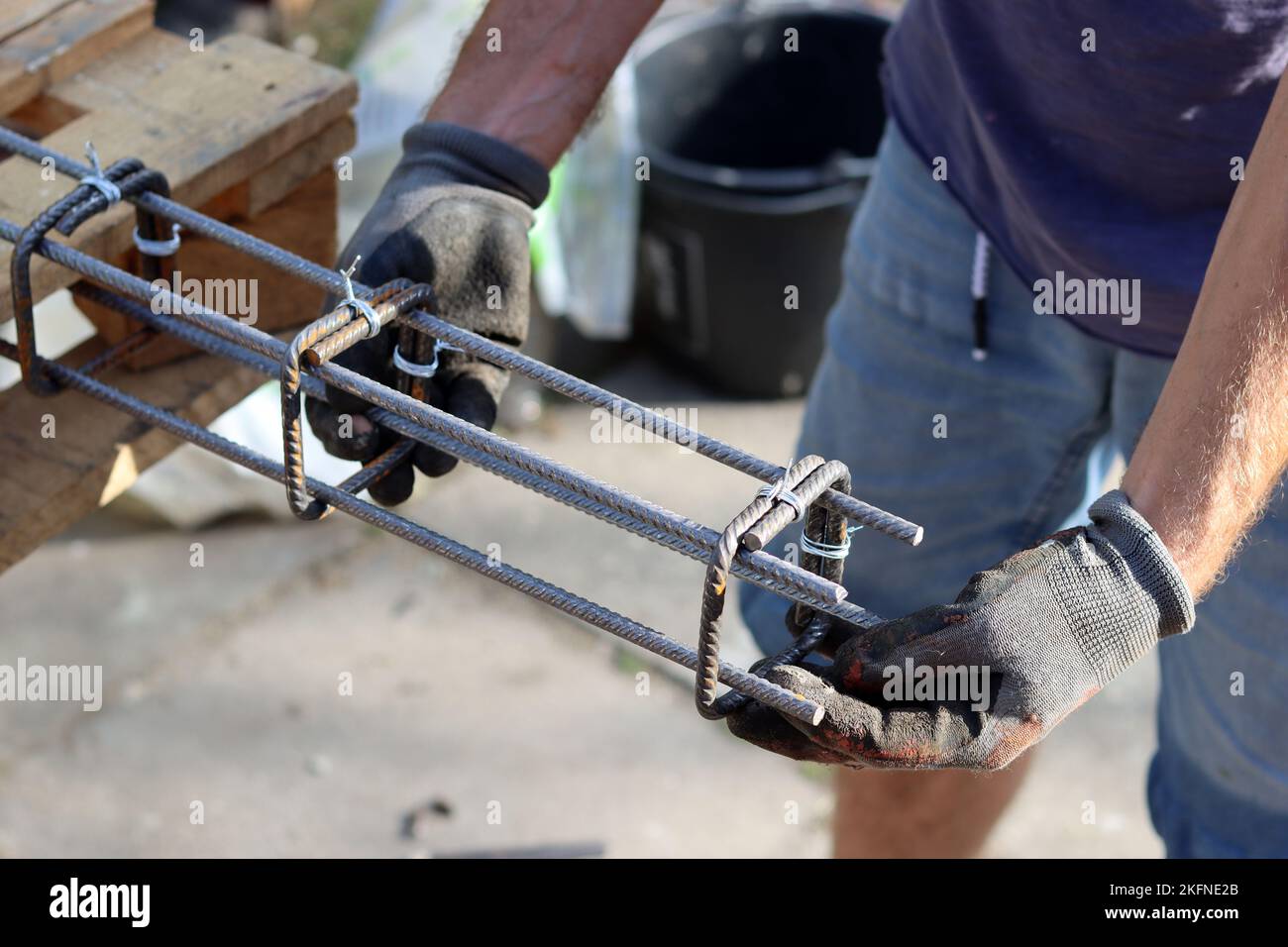 Close up photo of man holding pliers. Man works with reinforcement ...