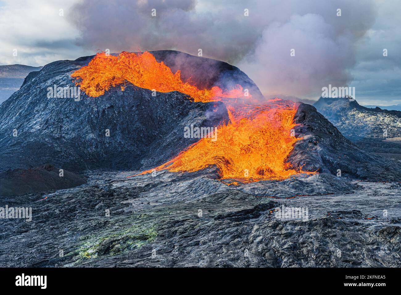 volcano during an eruption. strong lava flow from the volcanic crater ...