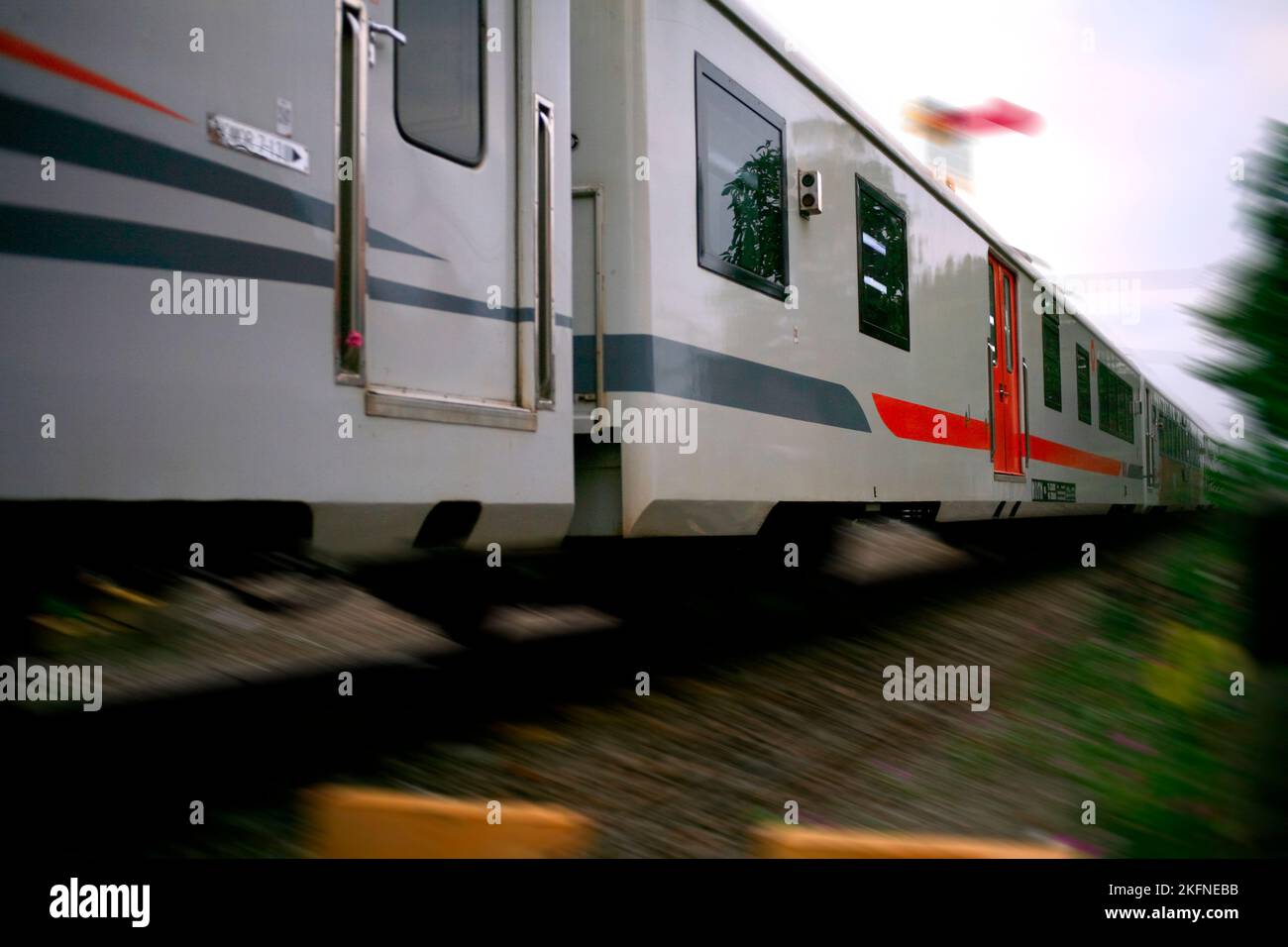 Motion blur of passanger train moving on railroad Stock Photo - Alamy
