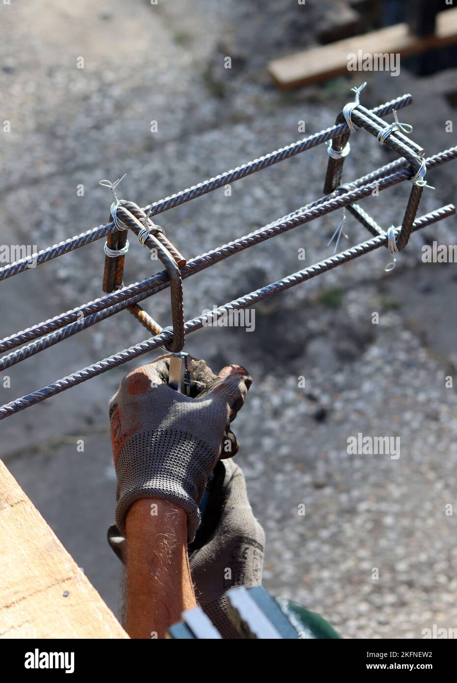 Hand holding reinforcement steel. Professional construction worker ...