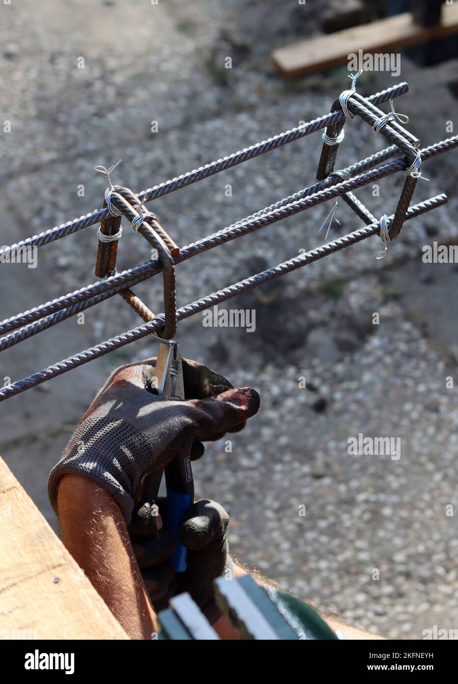 Close up photo of man holding pliers. Man works with reinforcement ...
