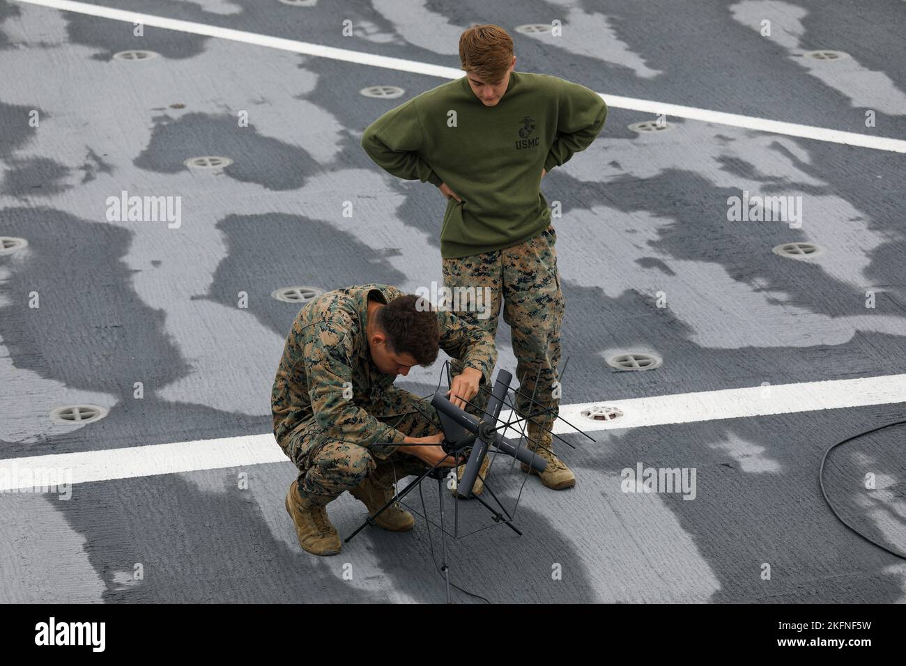 U.S. Marine Corps Cpl. Austin Smith, left, and Cpl. Christopher Eiklor ...