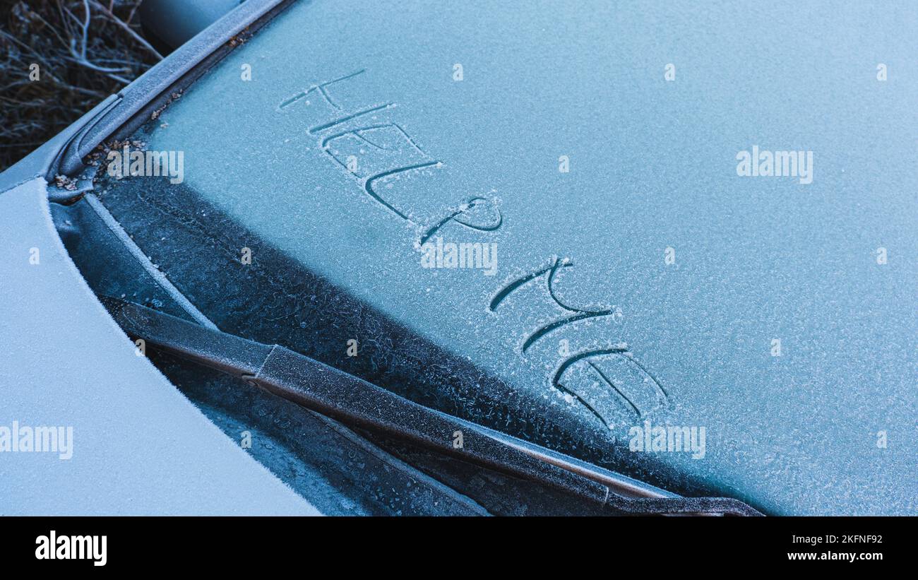 The text Help Me on the frozen glass of the car Stock Photo - Alamy