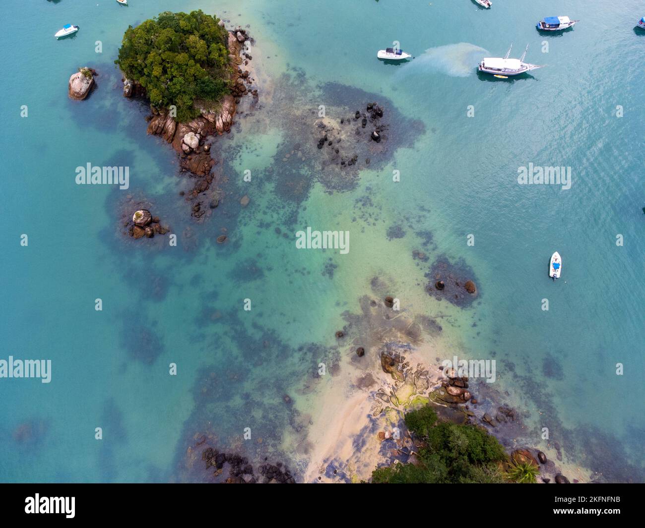 A bird's eye view of a little island on the shore of the Ilha Grande ...