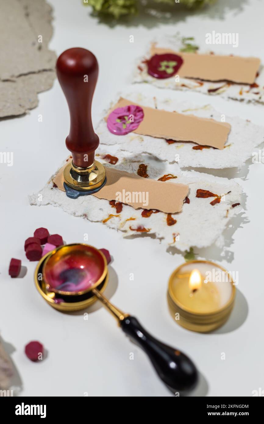 The process of creating wedding place cards from homemade recycled ...