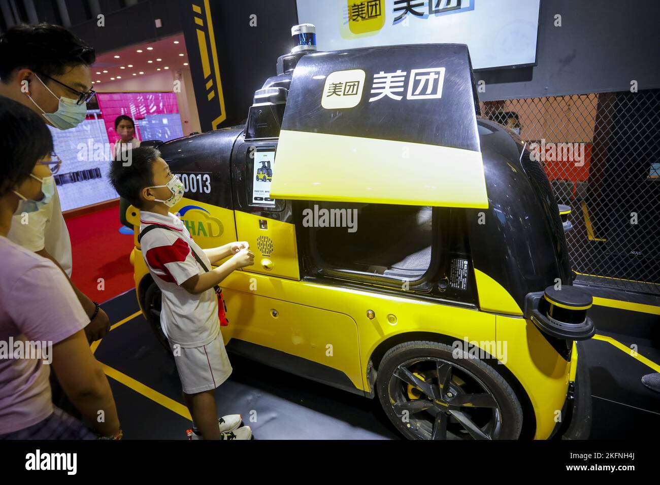 An unmanned delivery motor vehicle by Meituan is pictured. The 2022 ...