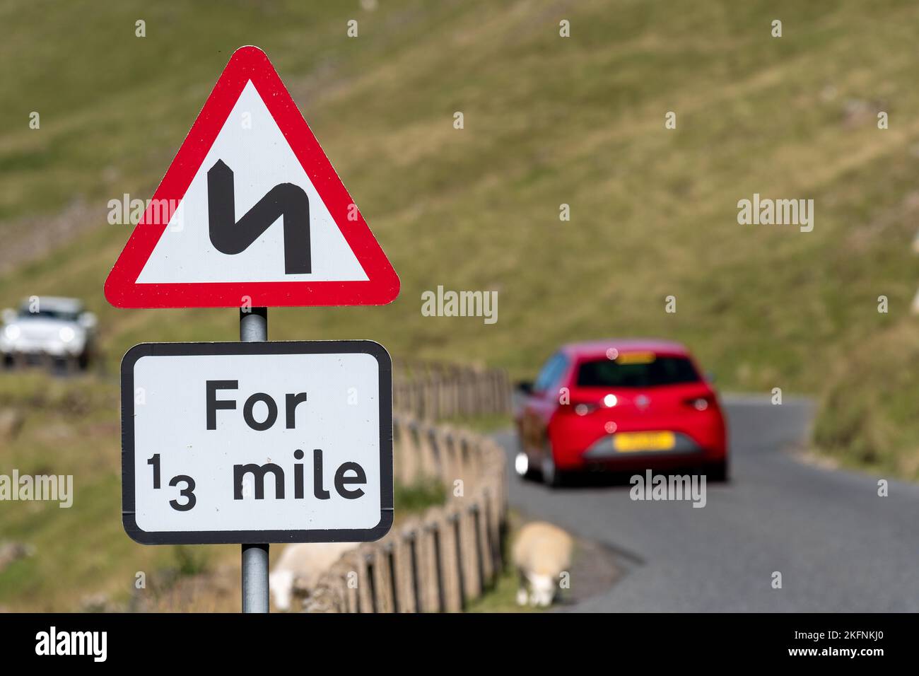 Windy road sign hi-res stock photography and images - Alamy
