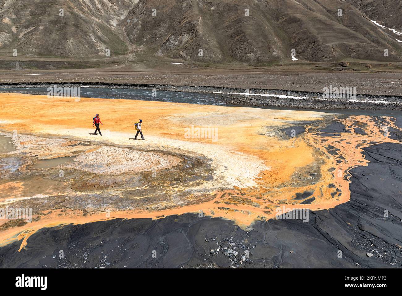 Hikers crossing Truso travertines national monument in truso valley in ...
