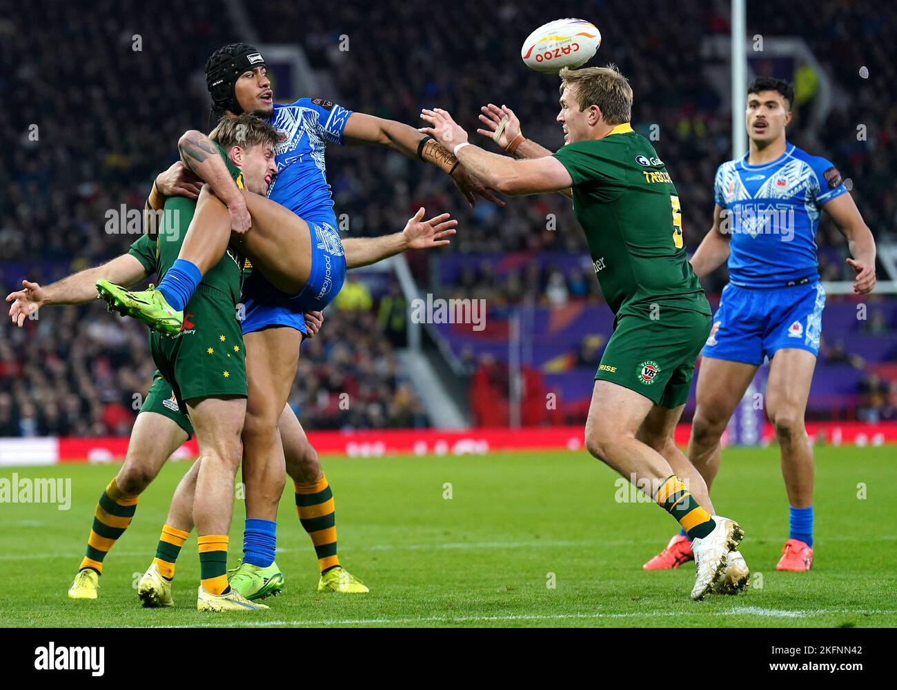 Samoa's Stephen Crichton is tackled by Australia's Cameron Munster ...