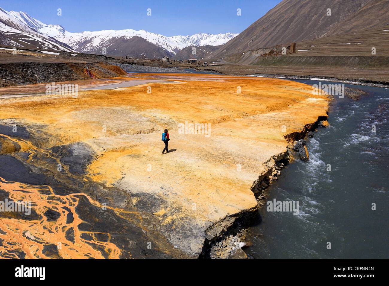 Aerial view of a hiker crossing Truso Travertines Natural Monument in ...