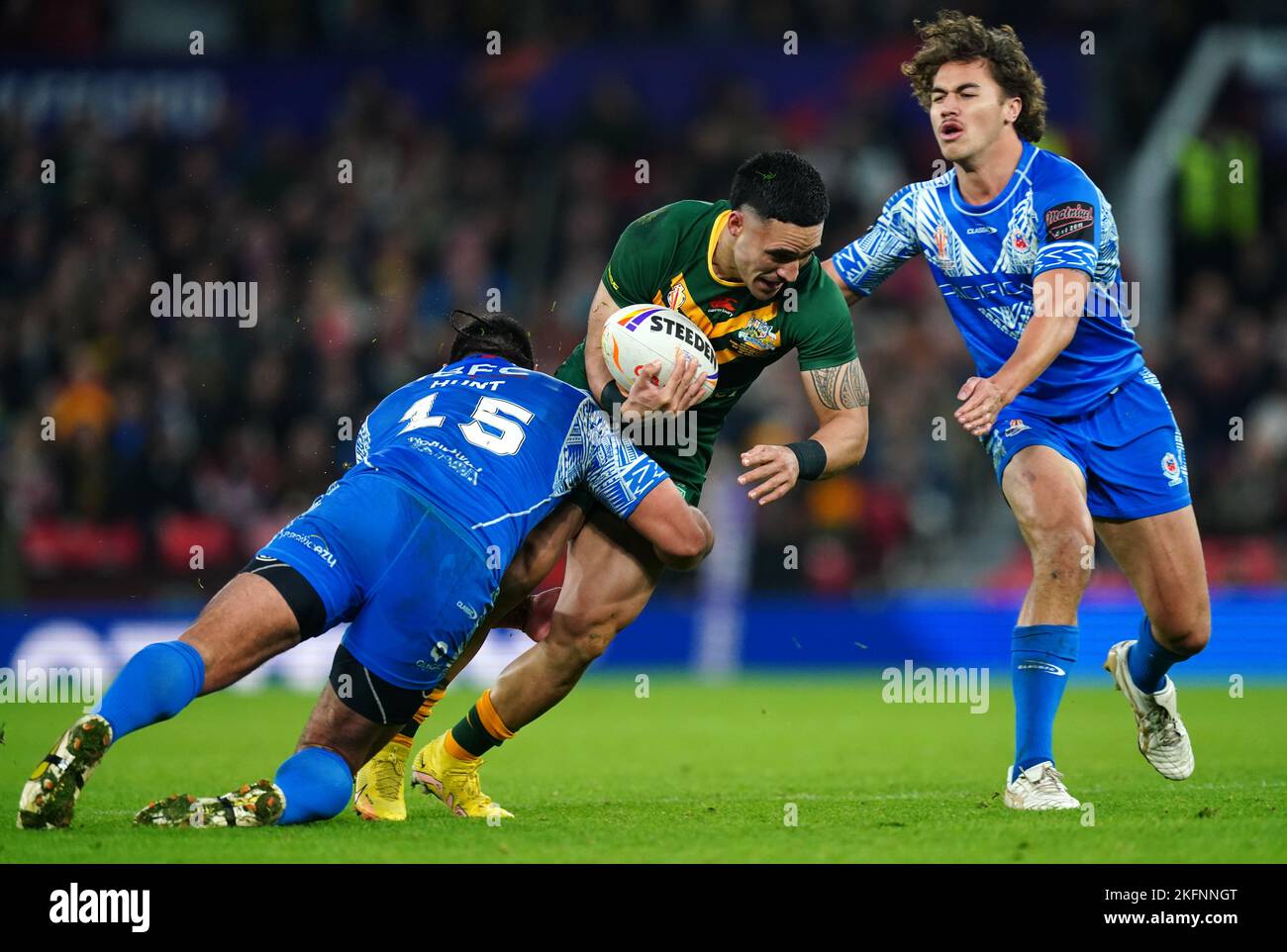 Australia's Valentine Holmes tacked by Samoa's Royce Hunt during the ...