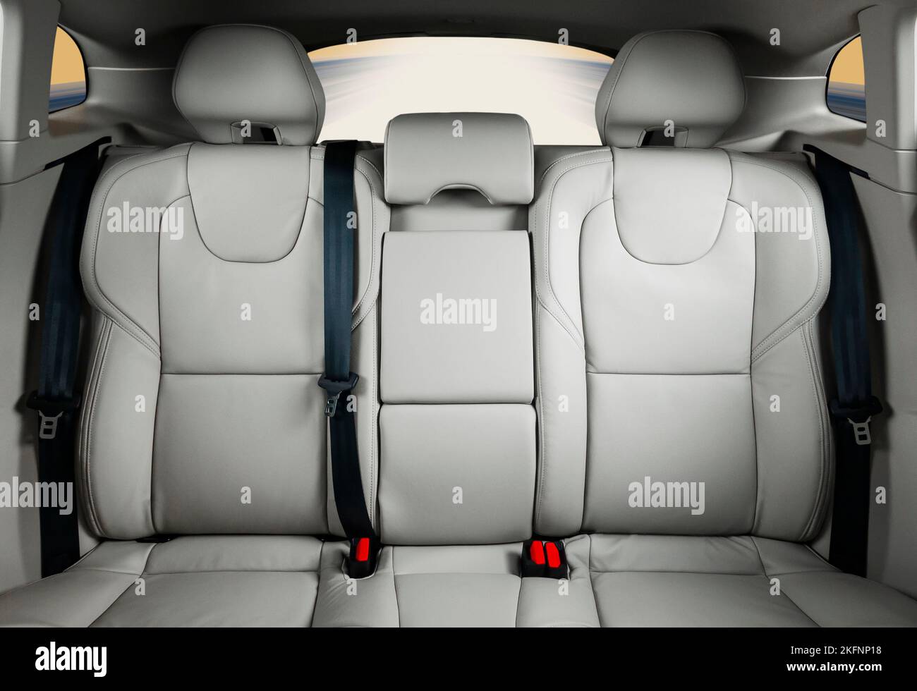 Back passenger seats in modern luxury car, frontal view, white leather ...