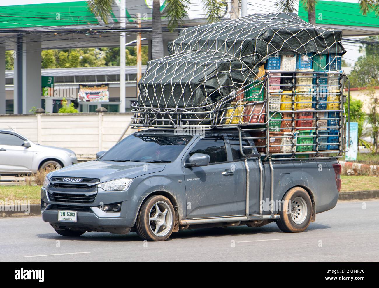 RATCHABURI, THAILAND, NOV 16 2022, A fully loaded pick up is driving ...
