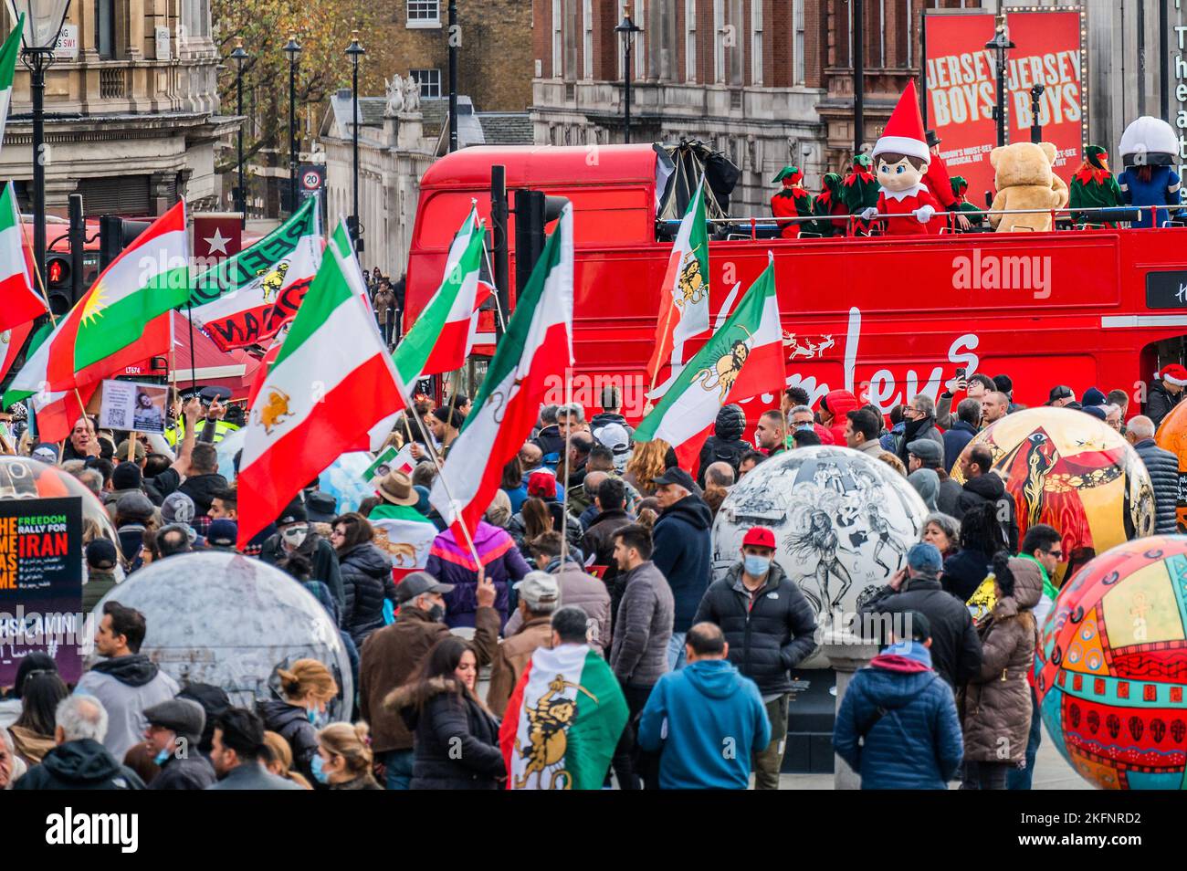 London, UK. 19th Nov, 2022. A Hamleys Christmas bus passes with Santa ...