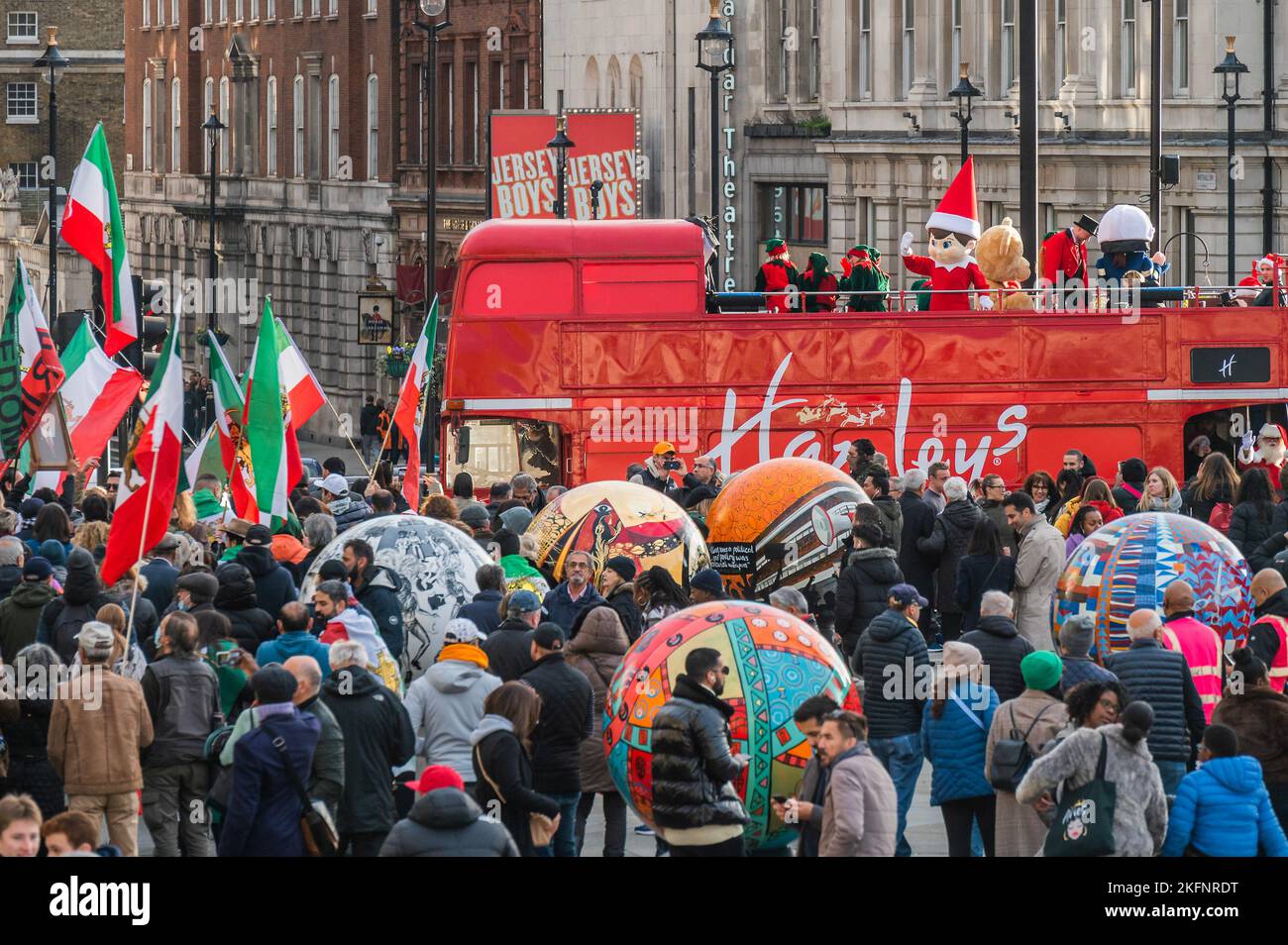 London, UK. 19th Nov, 2022. A Hamleys Christmas bus passes with Santa ...