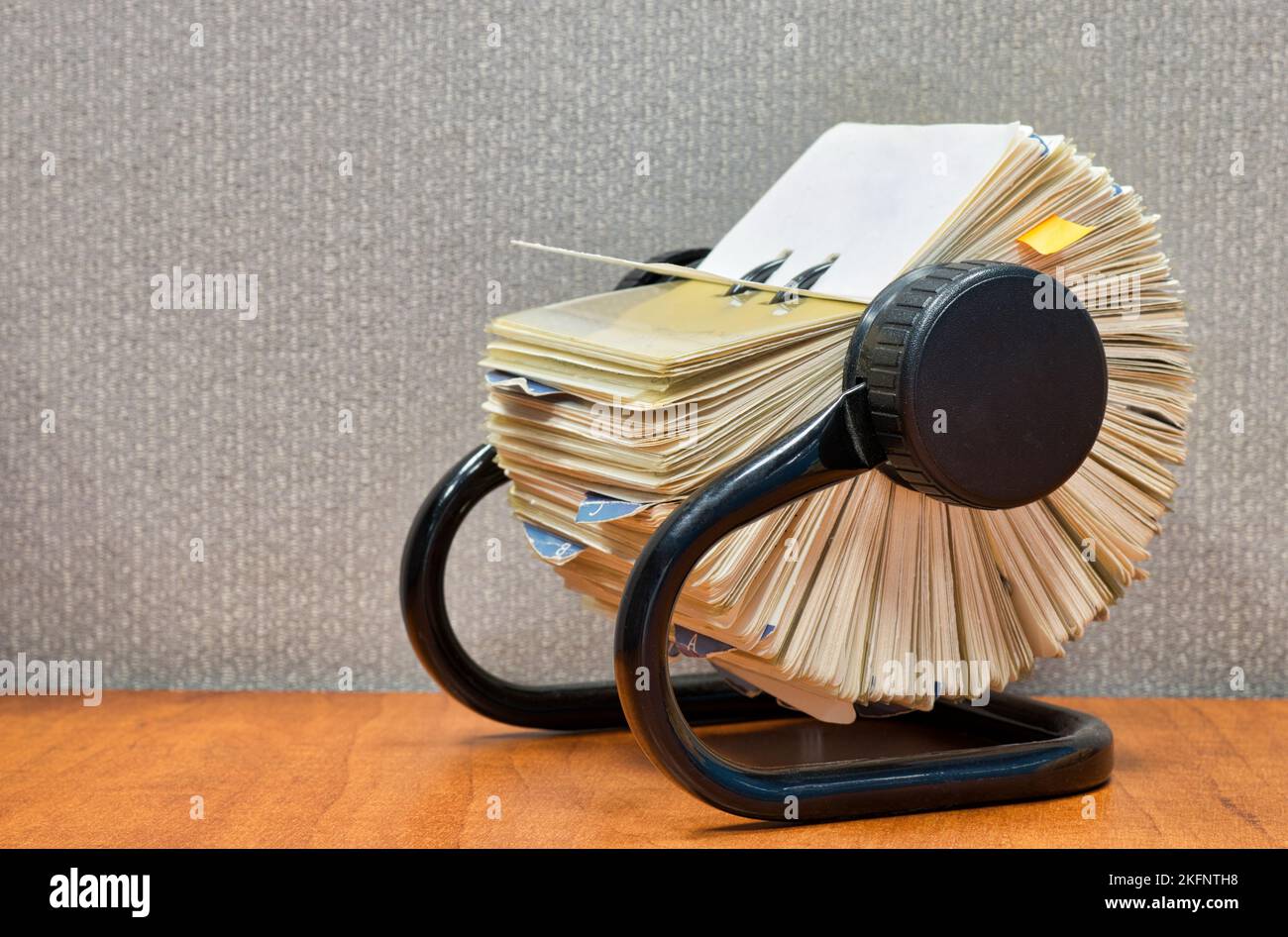 Rolodex file organizer sitting open on an office desk, angled view with ...