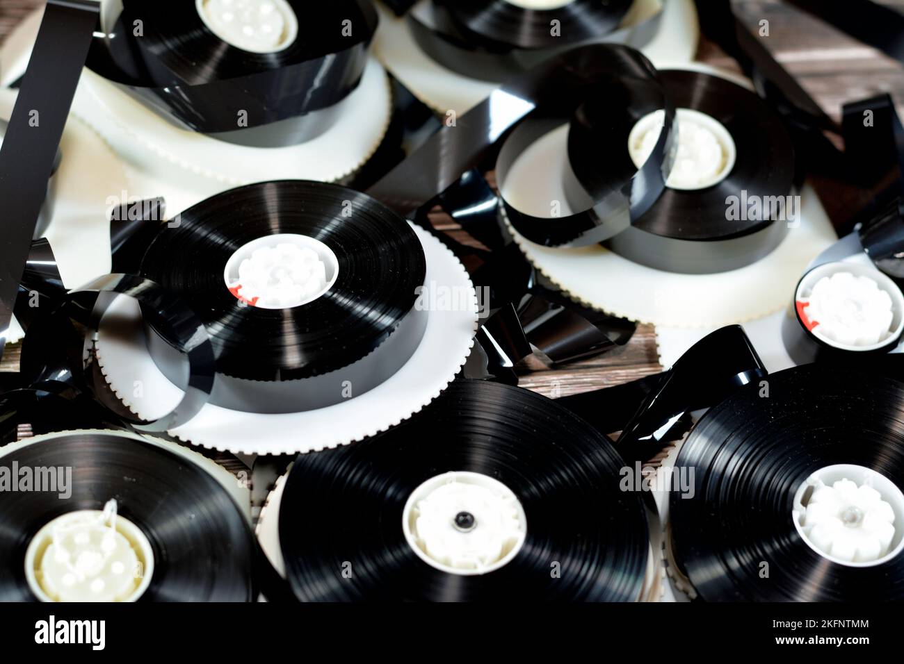 Tape ribbons with the supply and take up reels of VHS video cassette ...