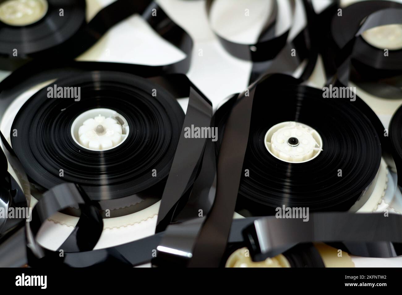 Tape ribbons with the supply and take up reels of VHS video cassette ...