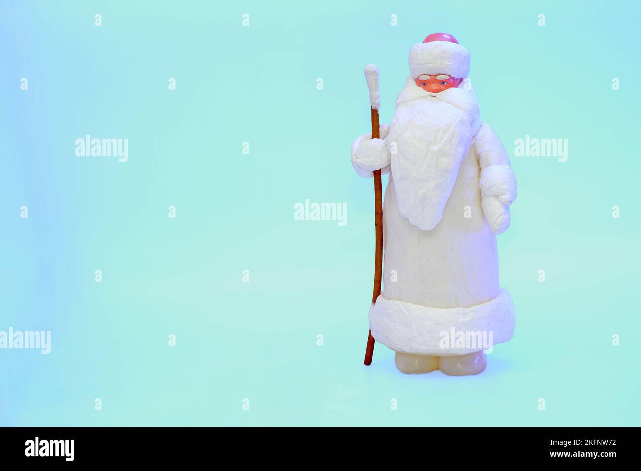 Santa claus with staff in white fur coat isolated on snow blue Stock ...