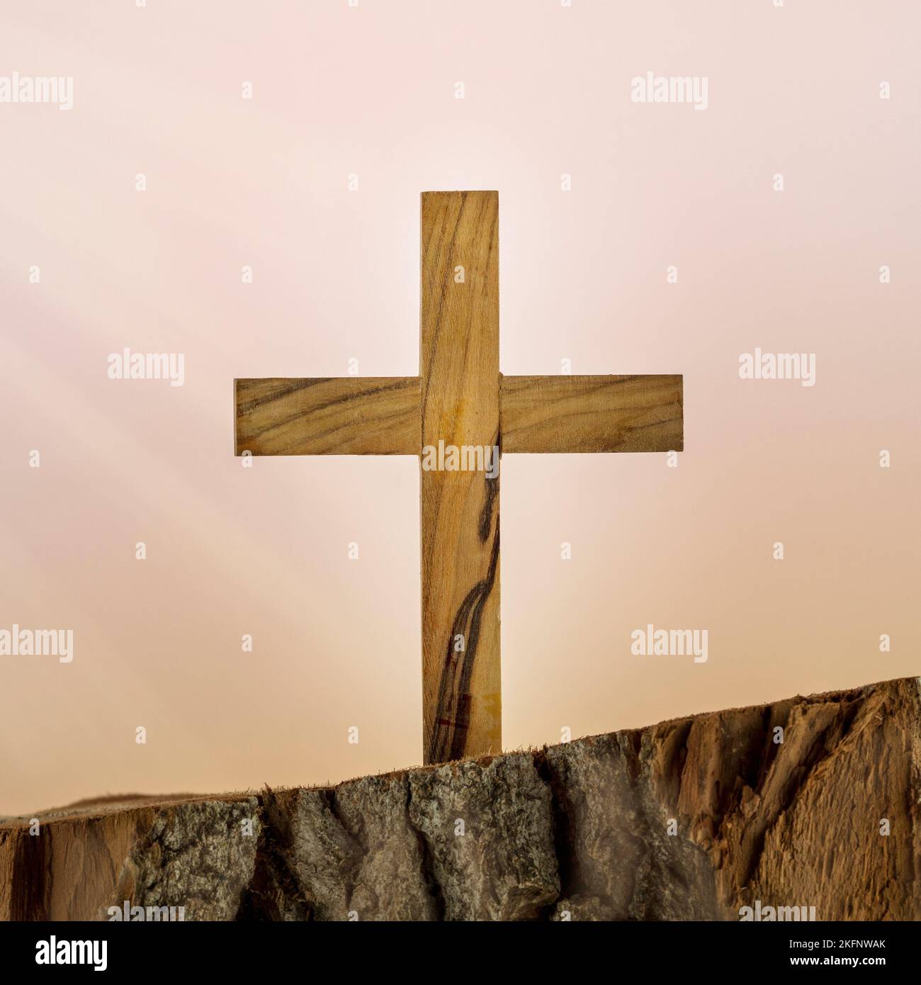 Christian wooden cross on a gradient background with dramatic lighting ...