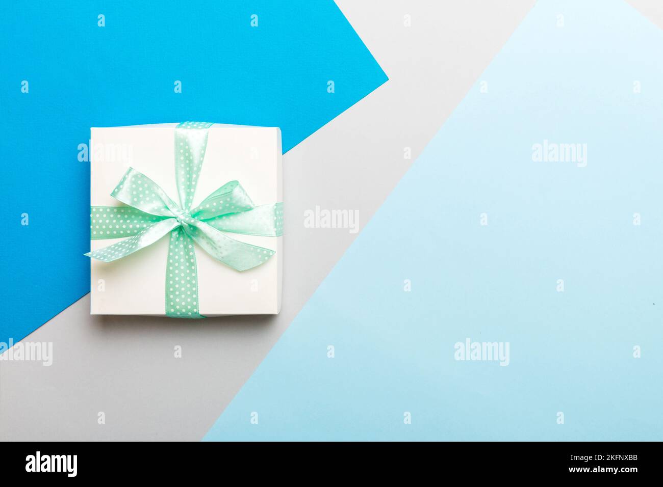 holiday handmade white present tied green ribbon bow top view with copy ...