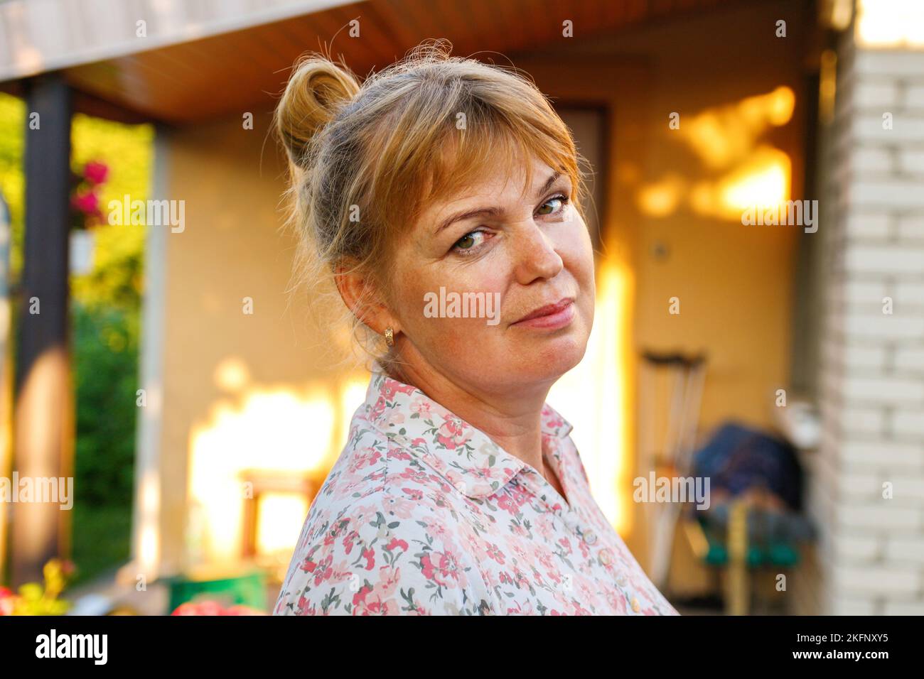 Defocus portrait of beautiful 40-year-old blond woman. Smiling 40s ...