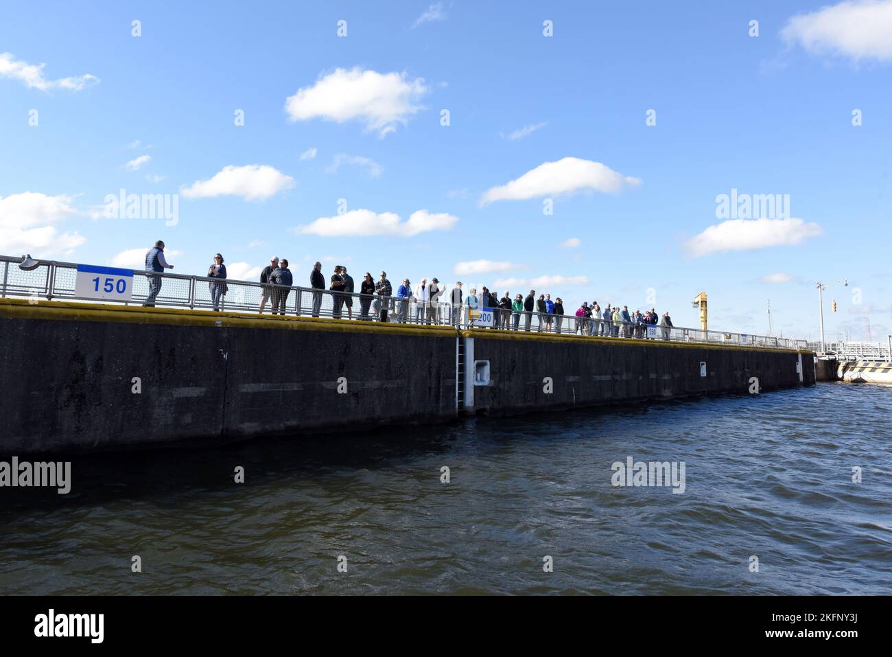 A large group of Tellico Village New Villagers look into the lock ...