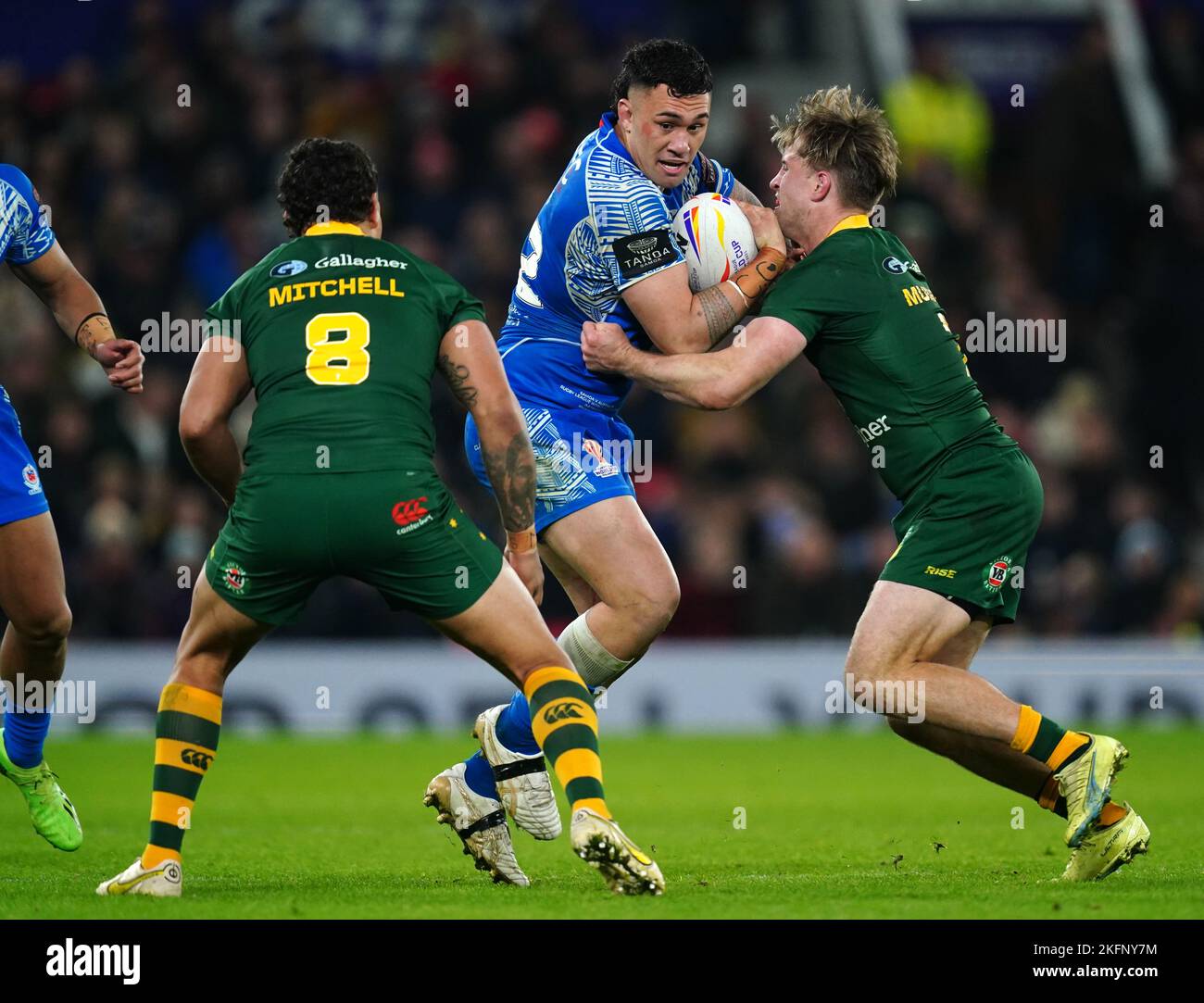 Samoa's Jaydn Su'a (centre) tackled by Australia's Latrell Mitchell and ...